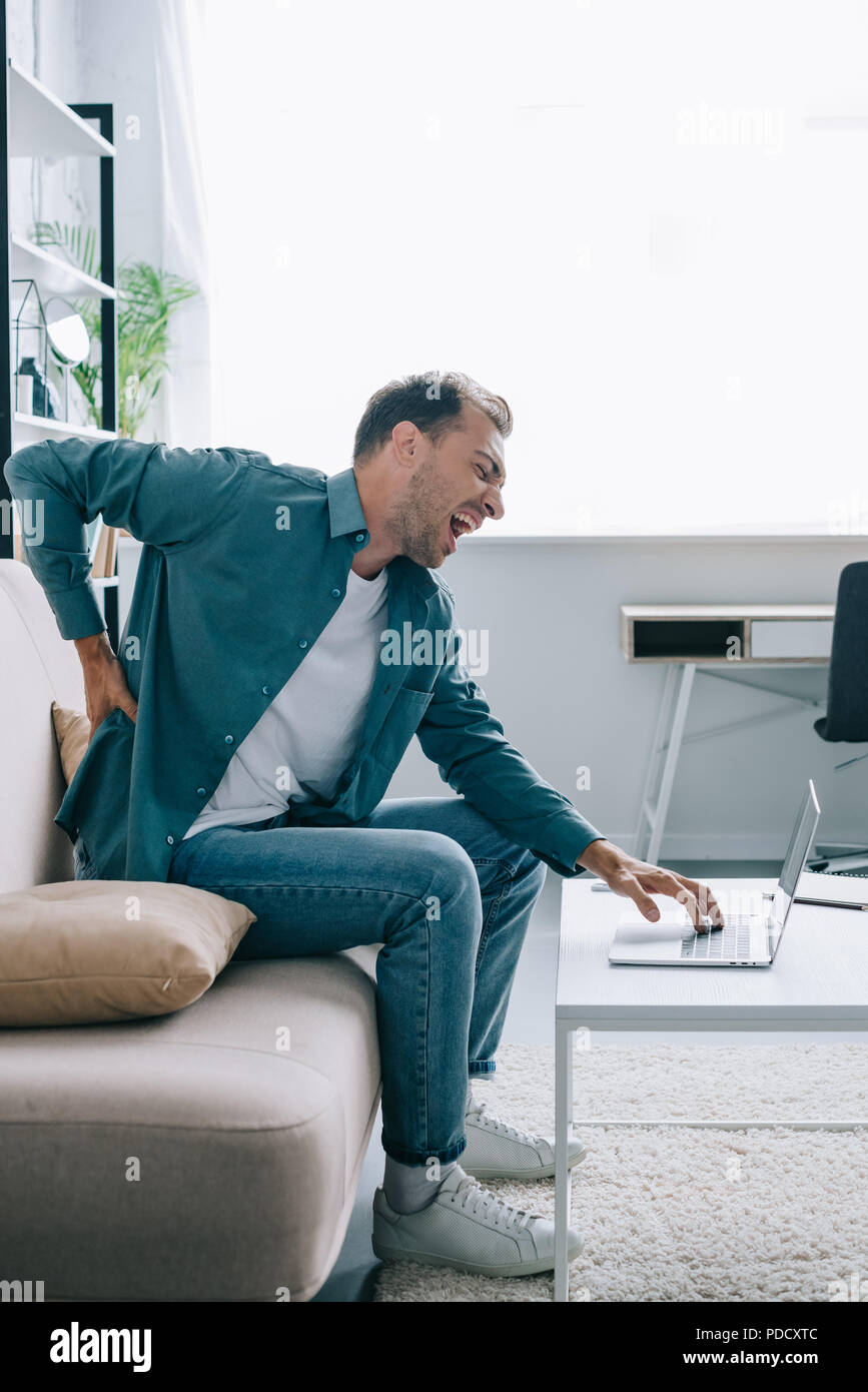 Casual man back pain using hi-res stock photography and images - Alamy