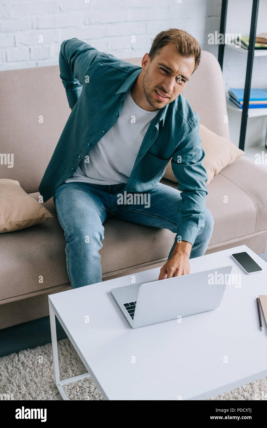 Casual man back pain using hi-res stock photography and images - Alamy