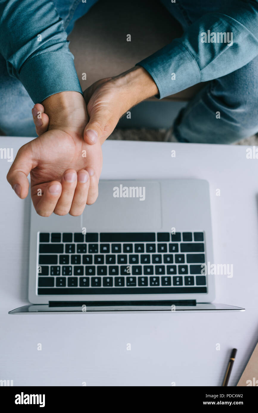 Man having wrist pain using hi-res stock photography and images - Alamy