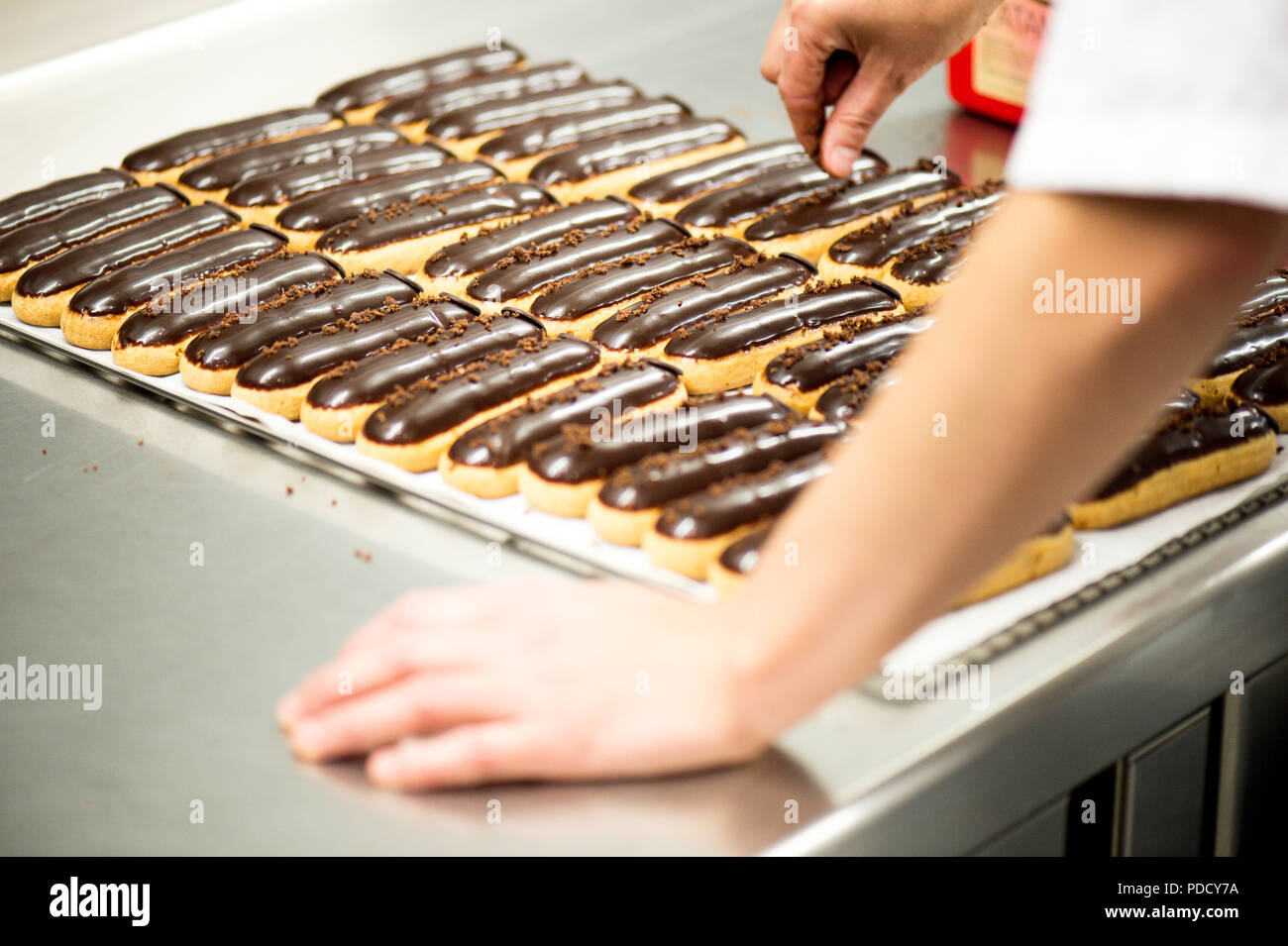 The colourful eclairs being made at L'Eclair de Genie kitchen ...