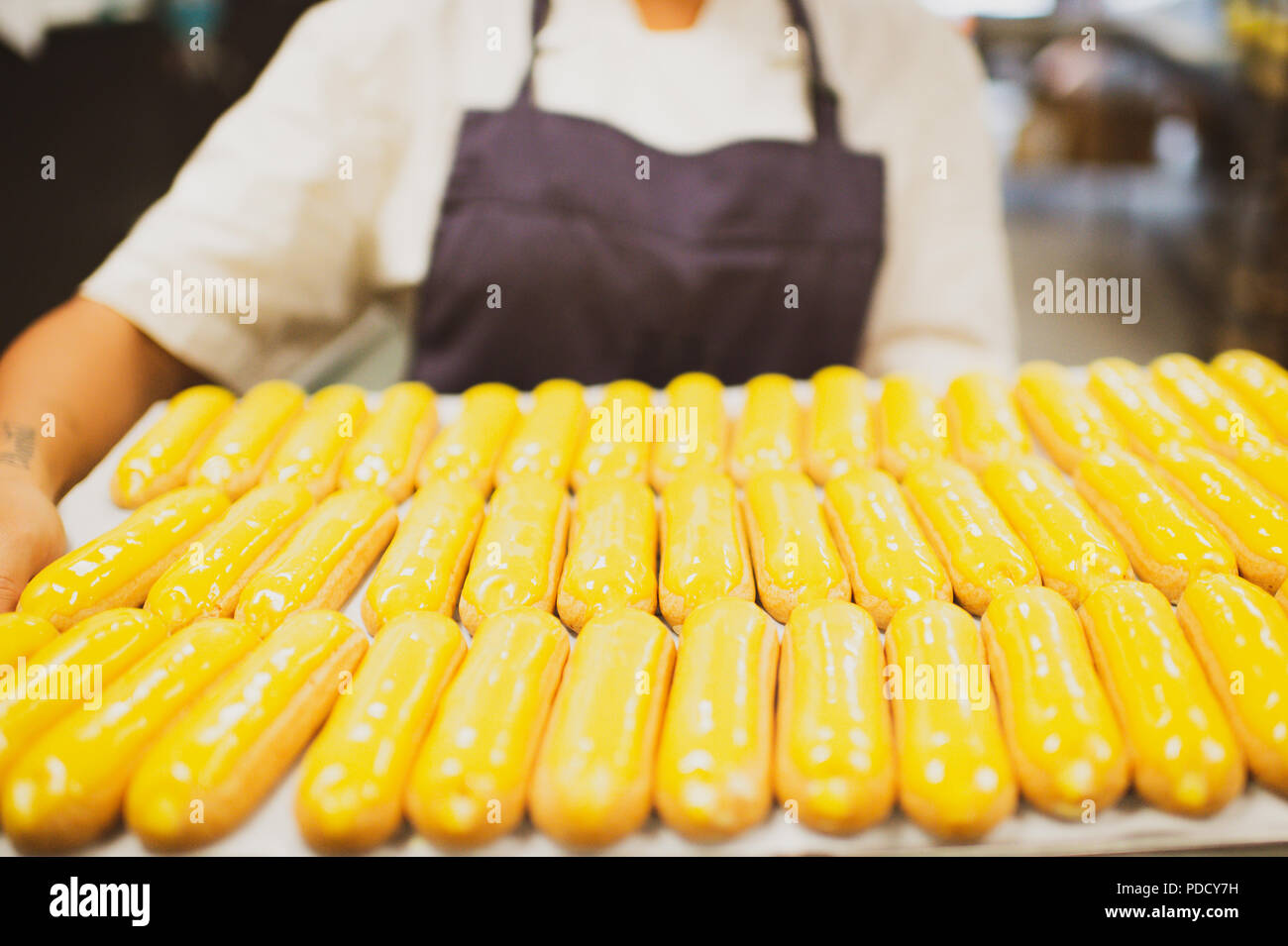 The colourful eclairs being made at L'Eclair de Genie kitchen ...
