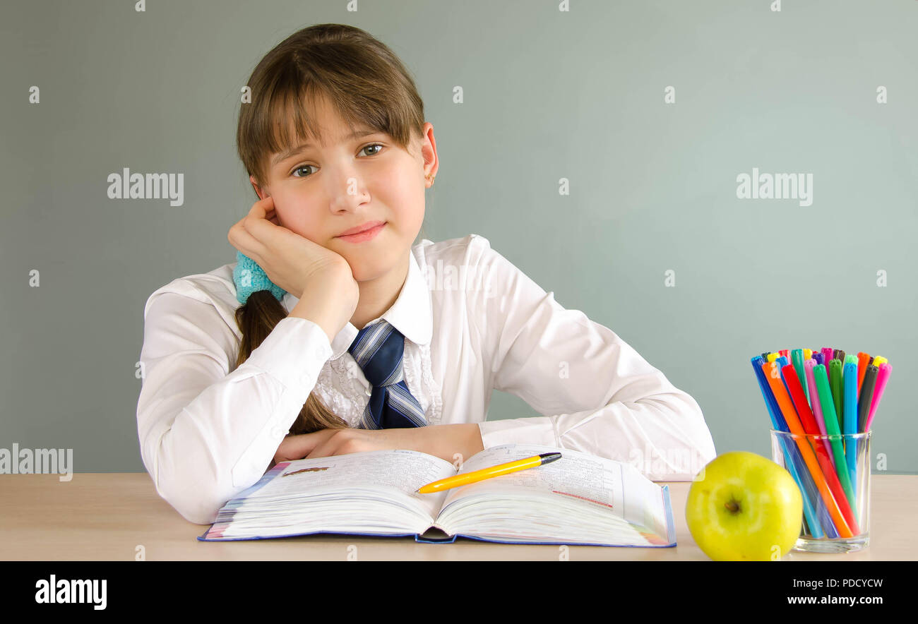 Girl schoolgirl studying at school desk - concept back to school Stock ...