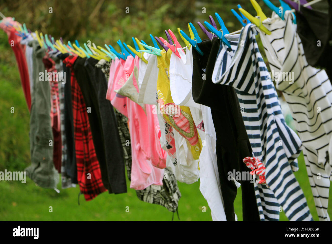 Children's clothes washing line hi-res stock photography and images - Alamy