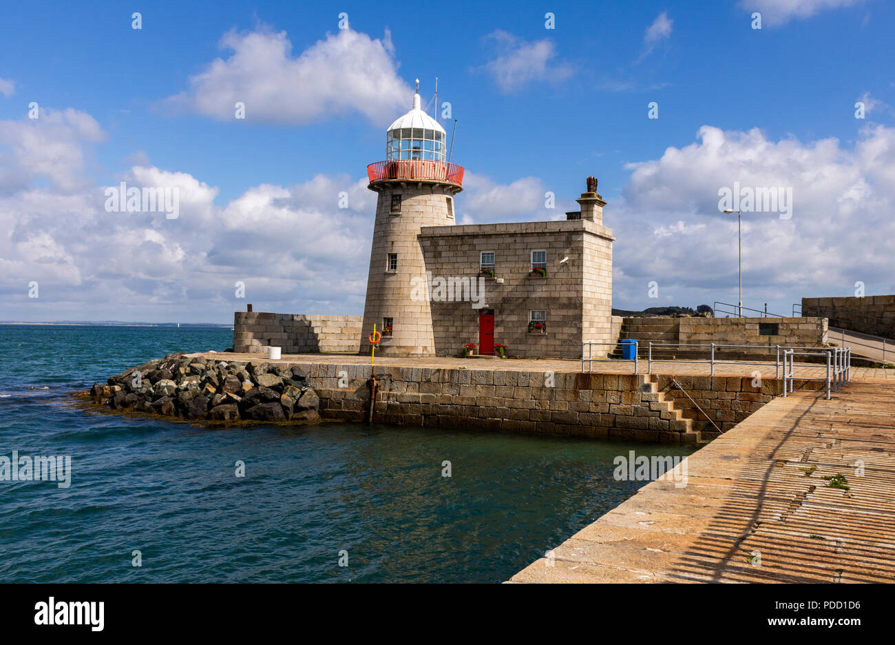 Howth Harbour Lighthouse, built in 1817, is located at the end of the ...