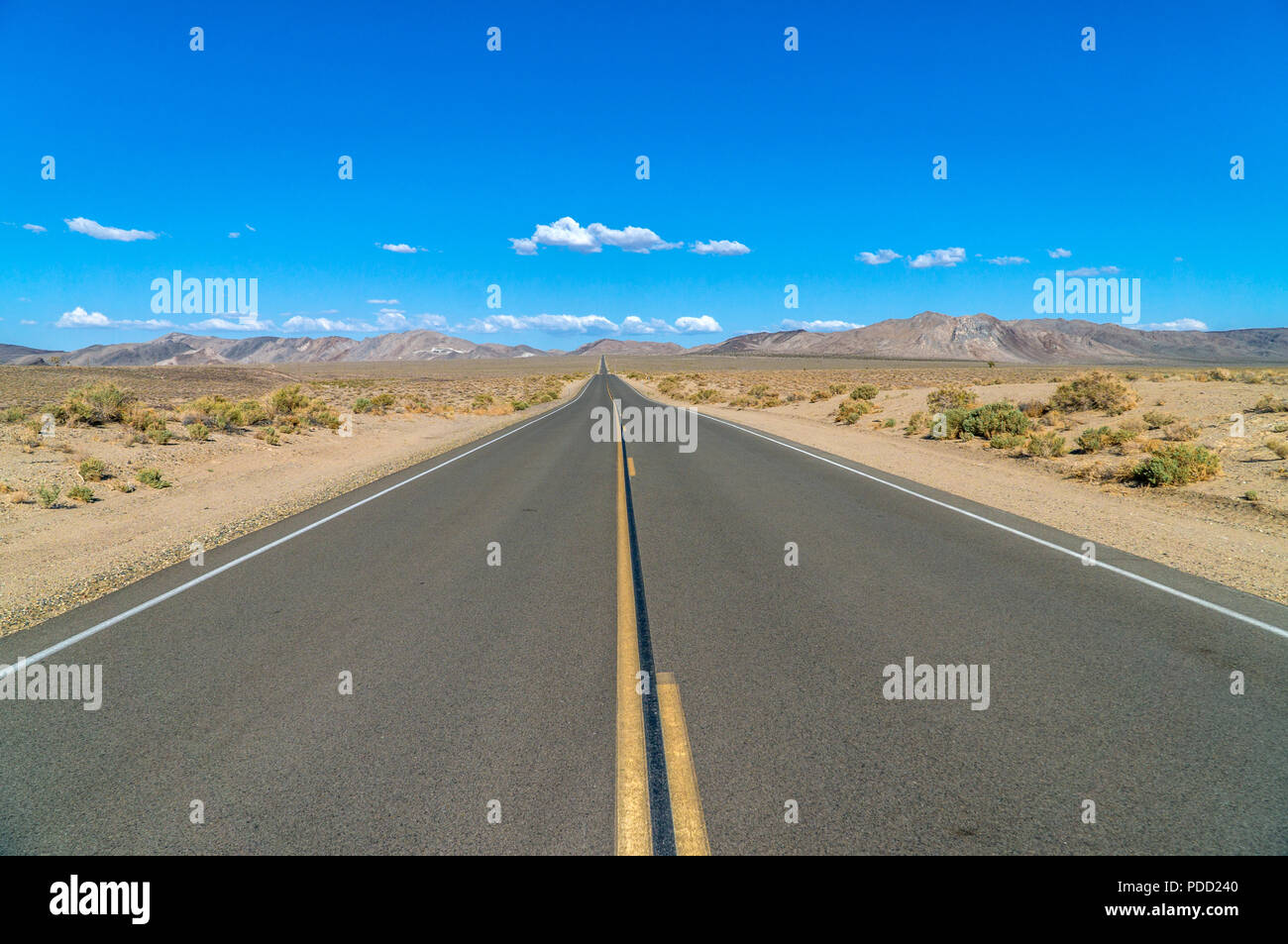 American asphalt road from low angle with mountains on background Stock ...
