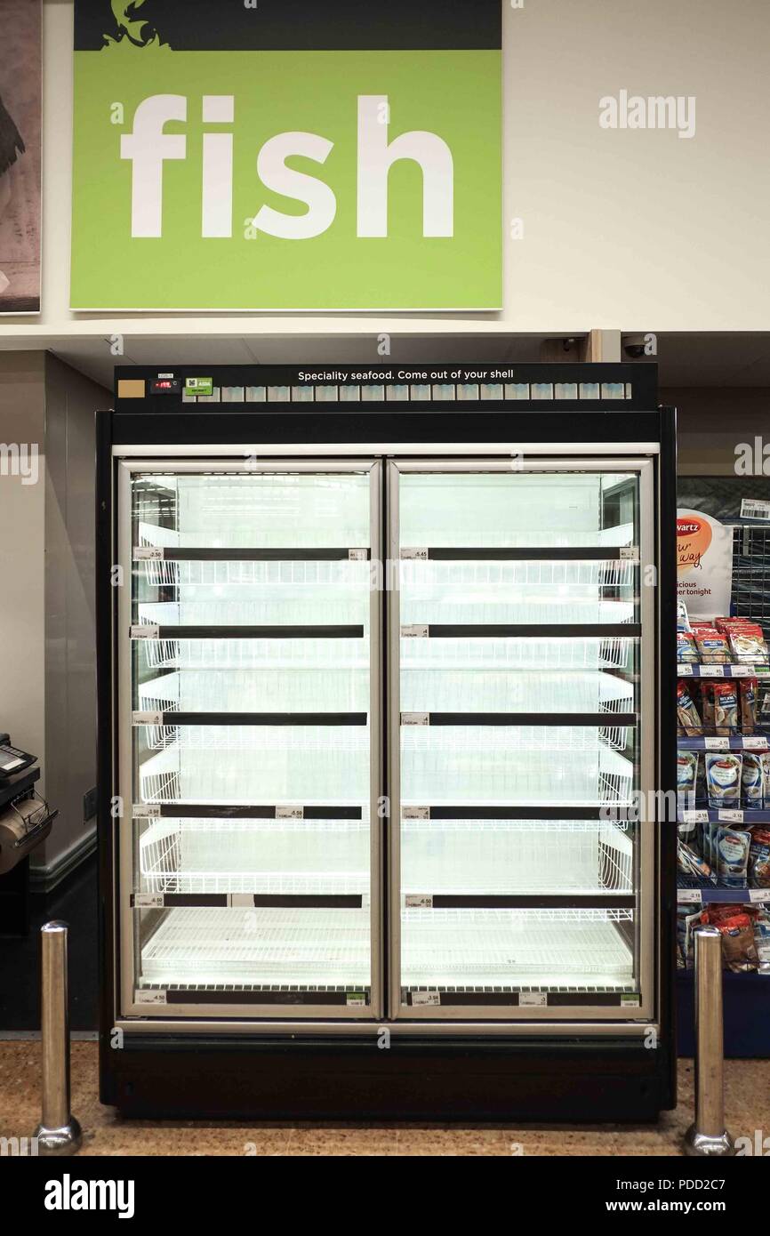 Empty fridge in Asda Supermarket with a Fish sign above Stock Photo - Alamy