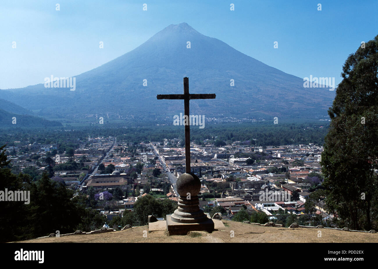 Cross on Cerro de la Cruz with view of Antigua and Volcano de Agua in ...