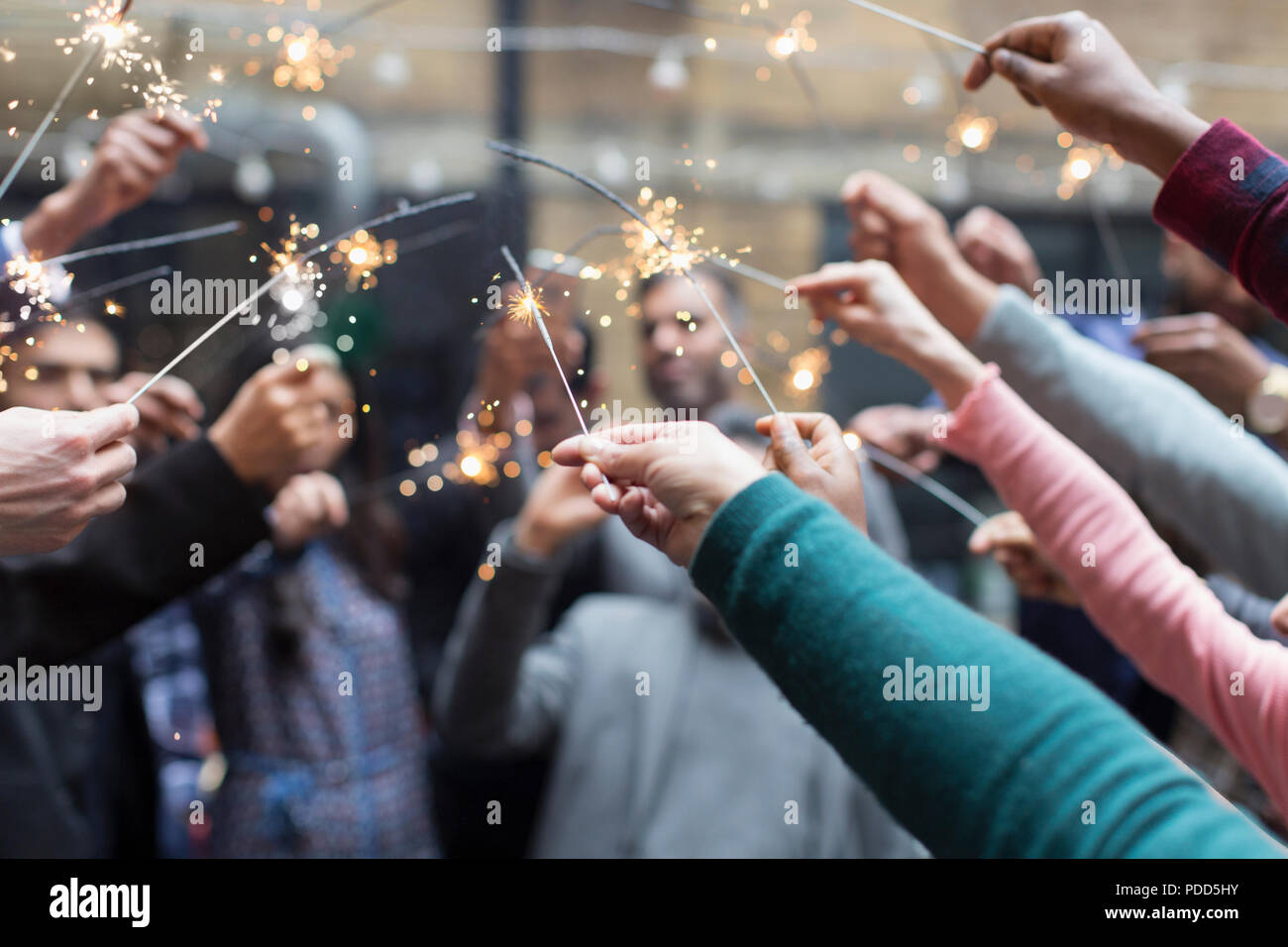 Group friends holding sparkler fireworks hi-res stock photography and ...