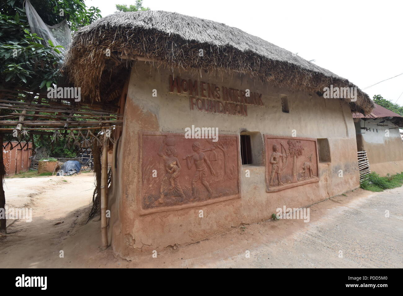 Tribal mud hut with mural of Bonerpukurdanga - a Santali village at ...
