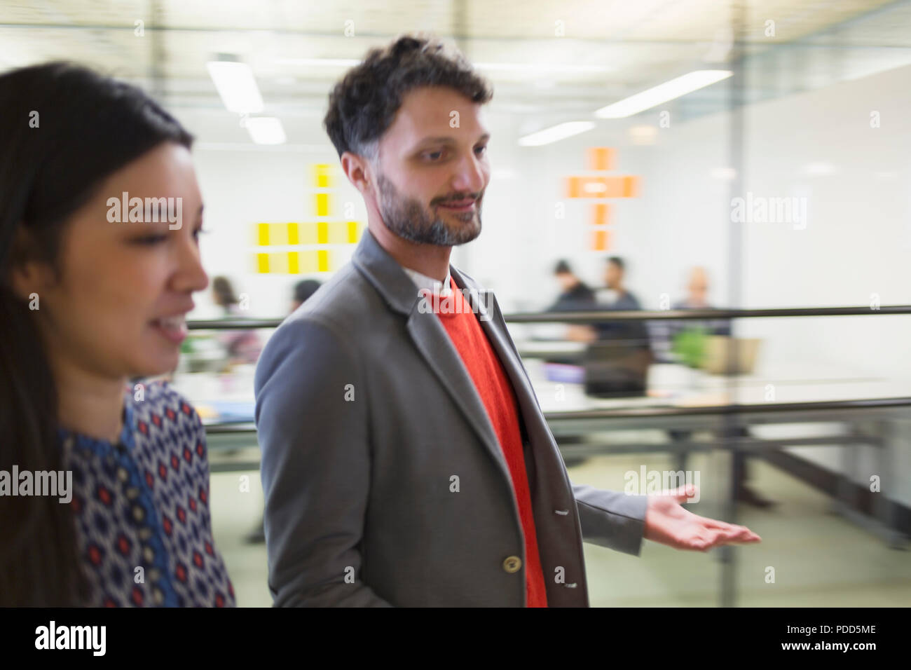 Business people walking in office Stock Photo - Alamy