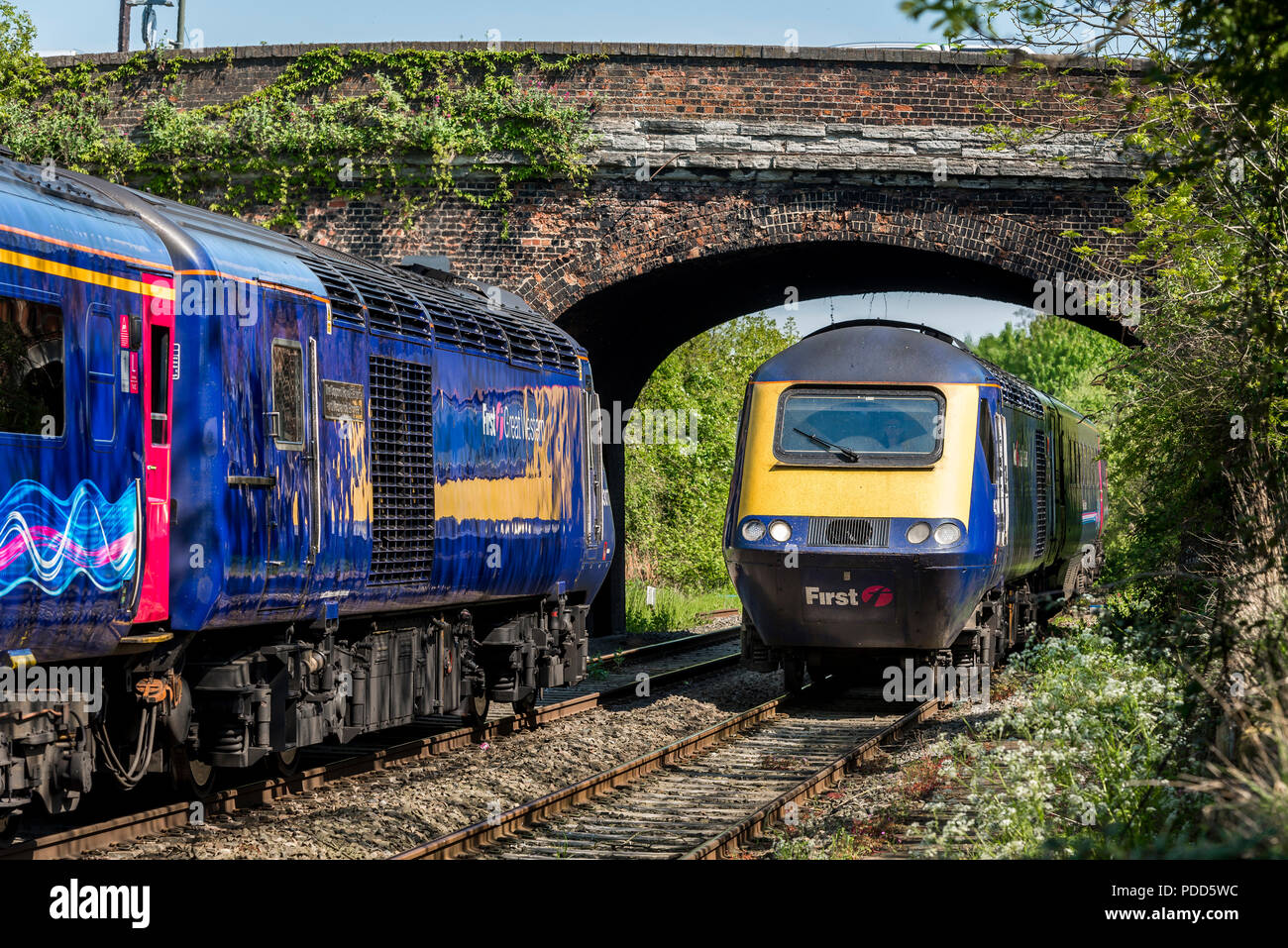 Class 43 trains in First Great Western livery passing beneath a bridge ...