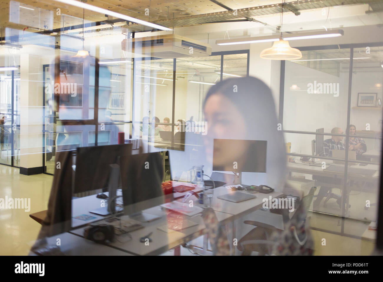 Business people behind glass in office Stock Photo - Alamy