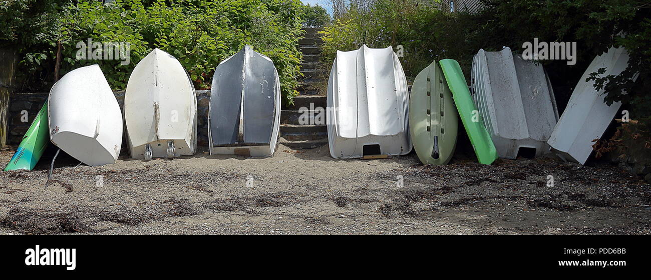 Boats laying on the shore inverted upside down Stock Photo - Alamy