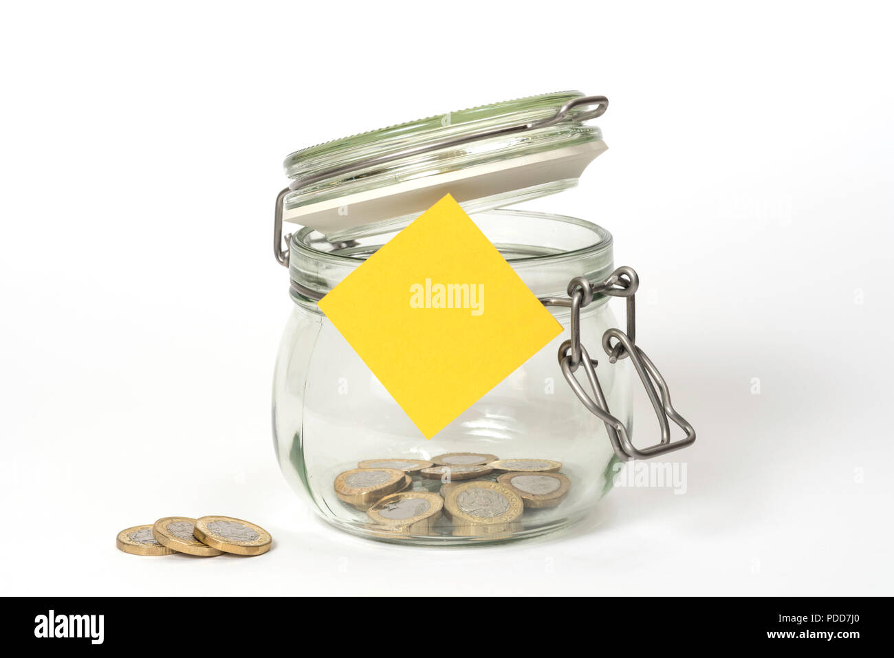 Slush fund: glass clip top Kilner storage jar with British one pound ...