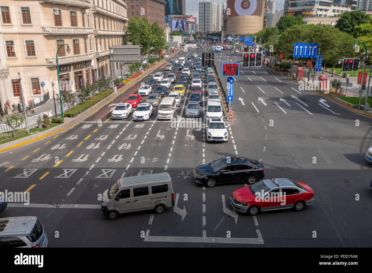 Busy road with people, cars and trucks in downtown Shanghai, China ...