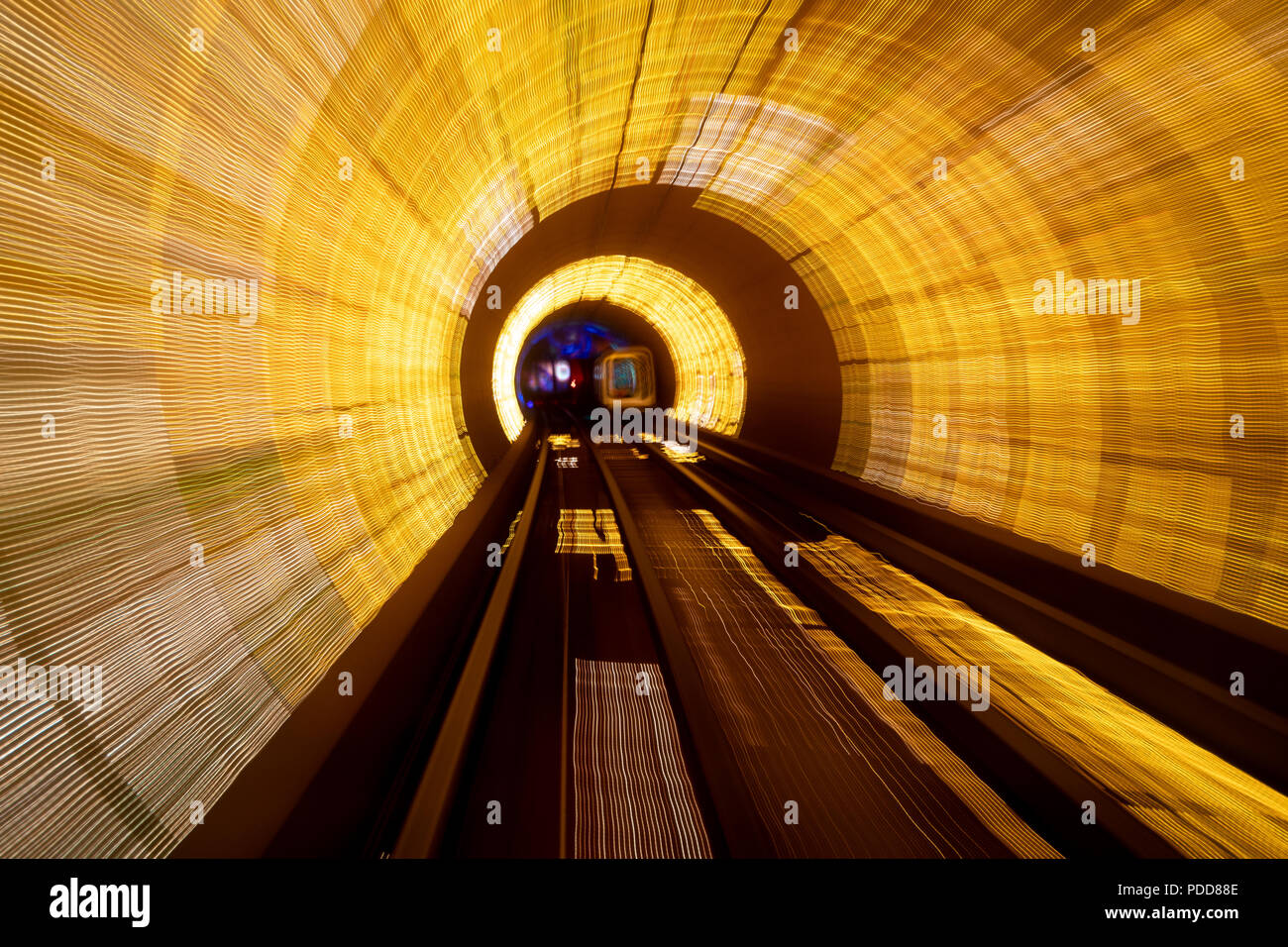 Light streaks. Long exposure from train passing through Bund Sightseeing Tunnel in Shanghai ...