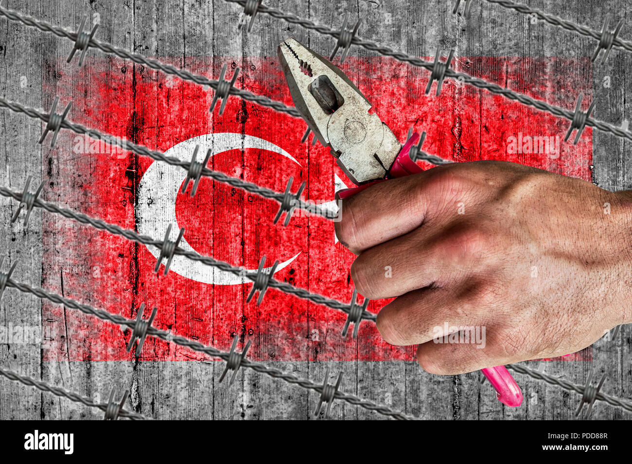 Turkey flag, STOP sign, migrants and barb wire with pliers Stock Photo ...