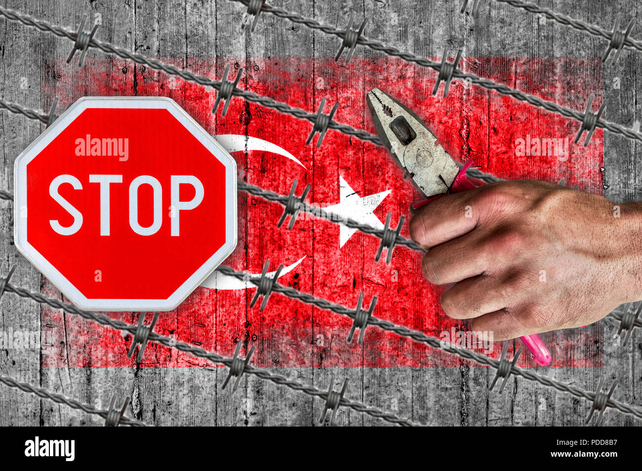 Turkey flag, STOP sign, migrants and barb wire with pliers Stock Photo ...