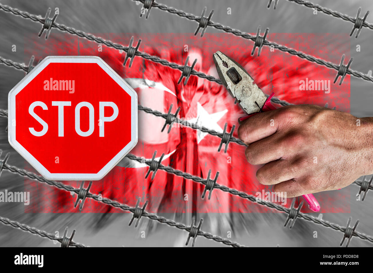 Turkey flag, STOP sign, migrants and barb wire with pliers Stock Photo ...