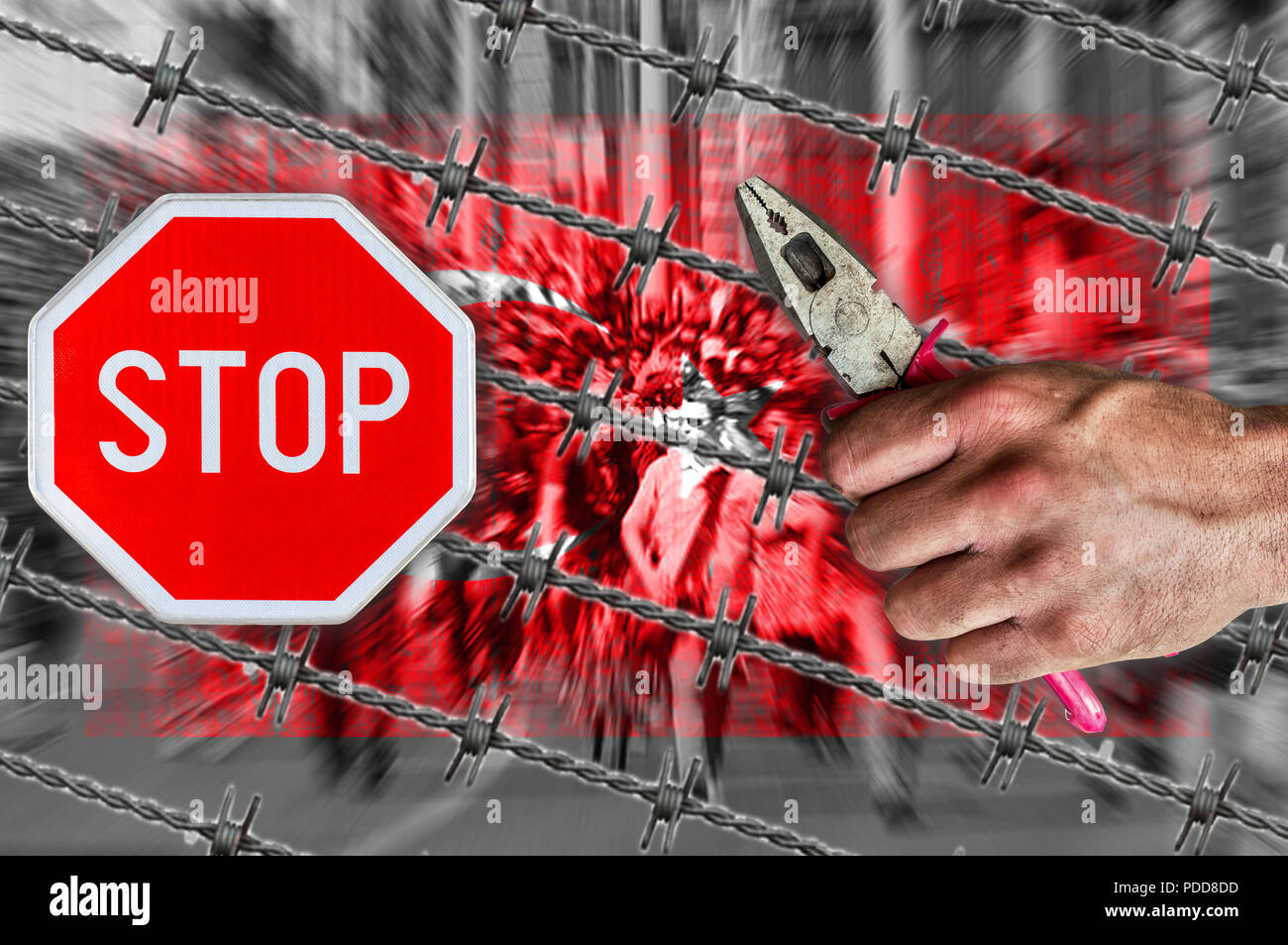 Turkey flag, STOP sign, migrants and barb wire with pliers Stock Photo ...