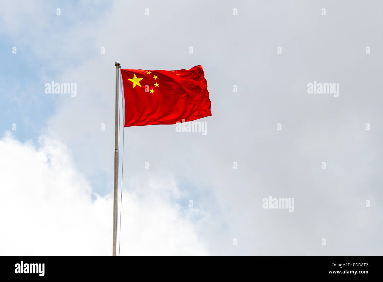 Chinese national flag flying from a pole Stock Photo - Alamy