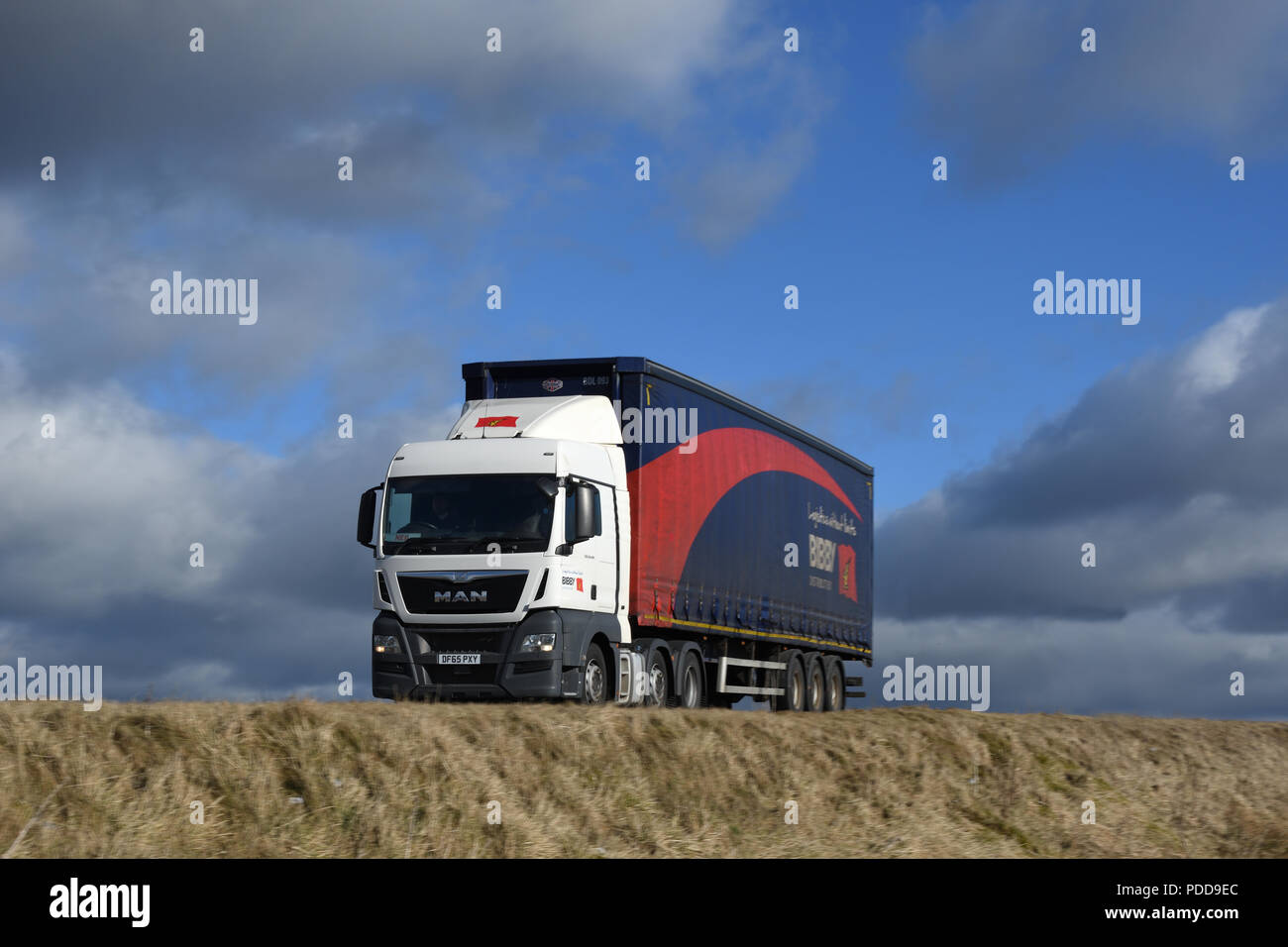 Man curtainsider truck on the Woodhead Pass, Yorkshire Stock Photo - Alamy