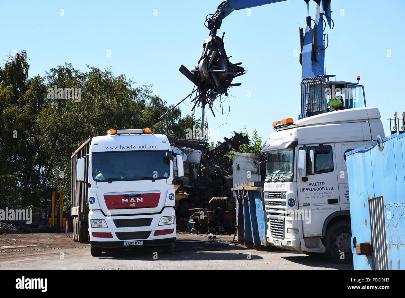 MAN bulk tipper being loaded with scrap metal in a Sheffield scrap yard ...