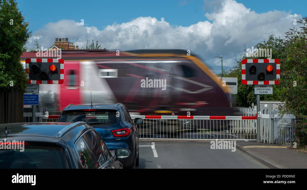 Railway Crossing, Stonehouse, Gloucestershire, UK. Drivers wait at a ...