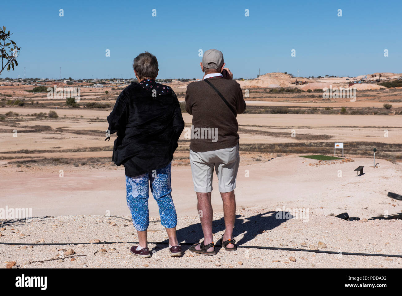 Australia, South Australia, Coober Pedy. Tourists overlooking the ...