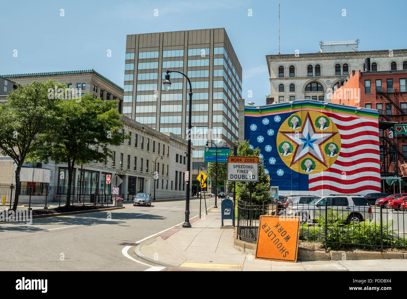 A patriotic mural painted on the side of a building on Foster Street ...