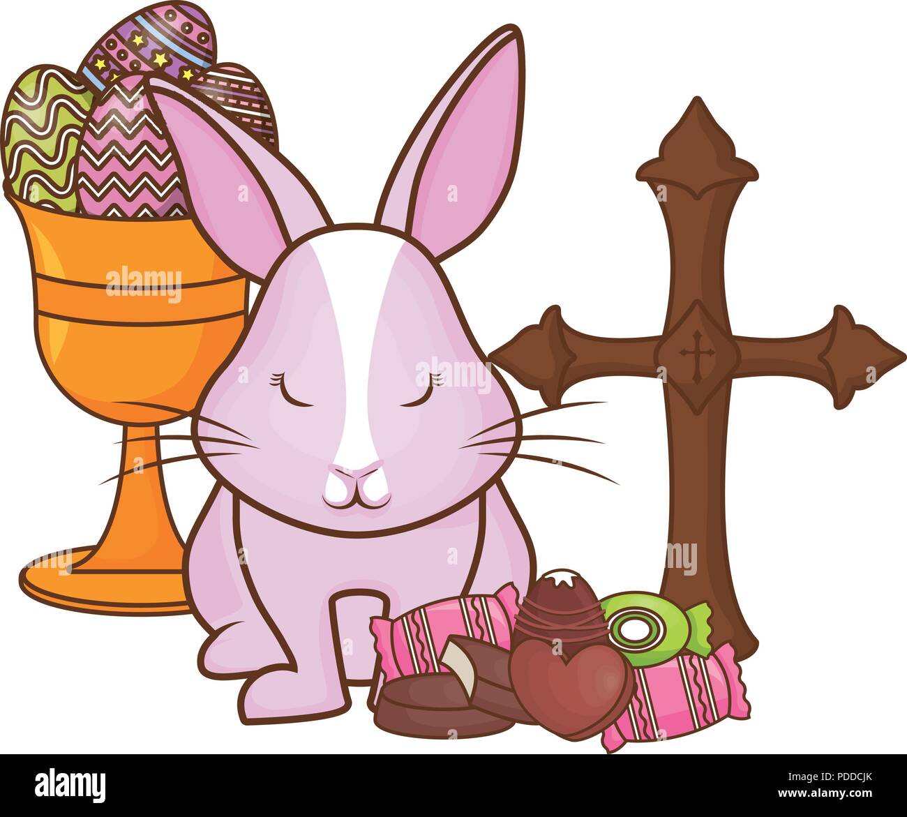 religious cross with cute rabbit and holy grail with candies over white ...