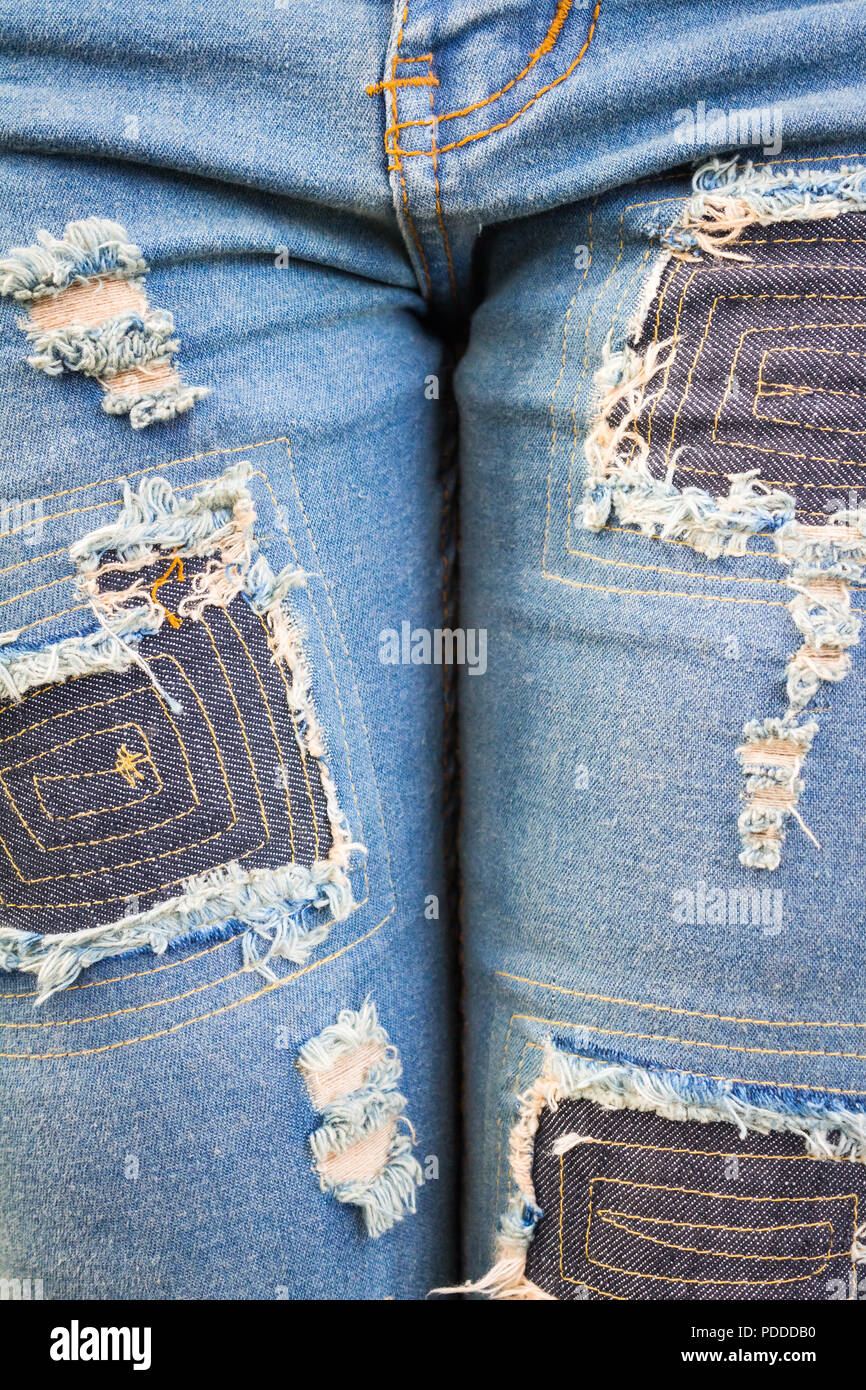 Blue torn denim jeans texture Stock Photo - Alamy