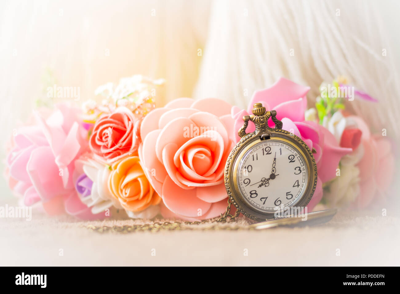 Vintage pocket watch with rose bouquet Stock Photo - Alamy