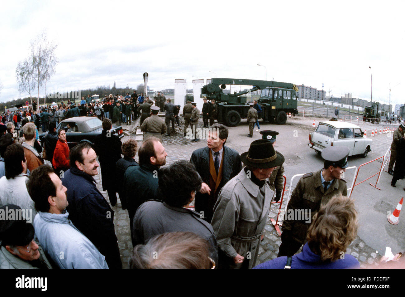 Berlin Wall 1989 - A crowd gathers as cars pass through the newly ...