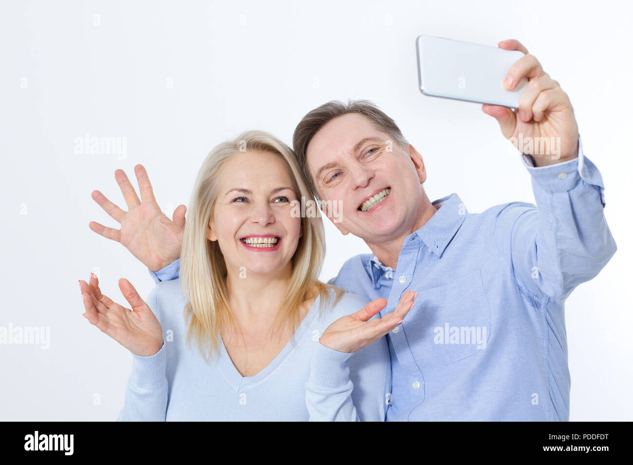 Happy Middle Aged Couple Taking Selfie With Smartphone Isolated On