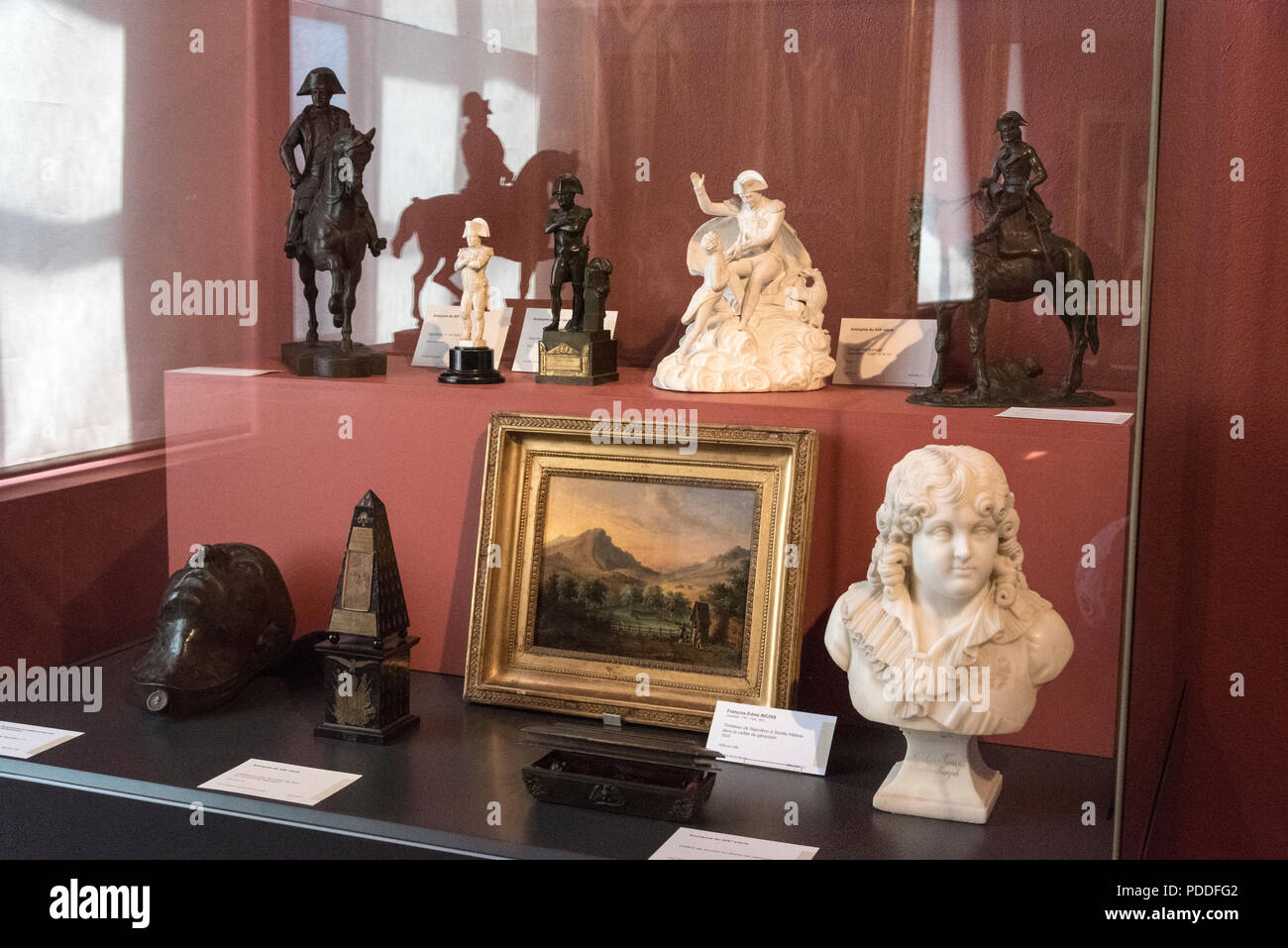 A large cabinet display of various models of Napoleon Bonaparte at the ...