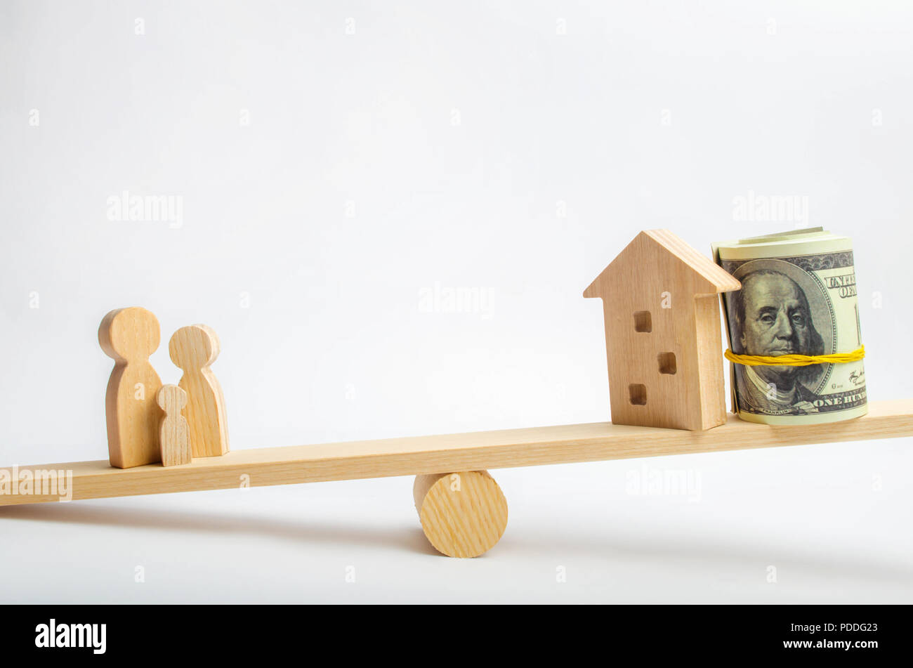house, dollars and family on the scales. balance. buying, selling ...