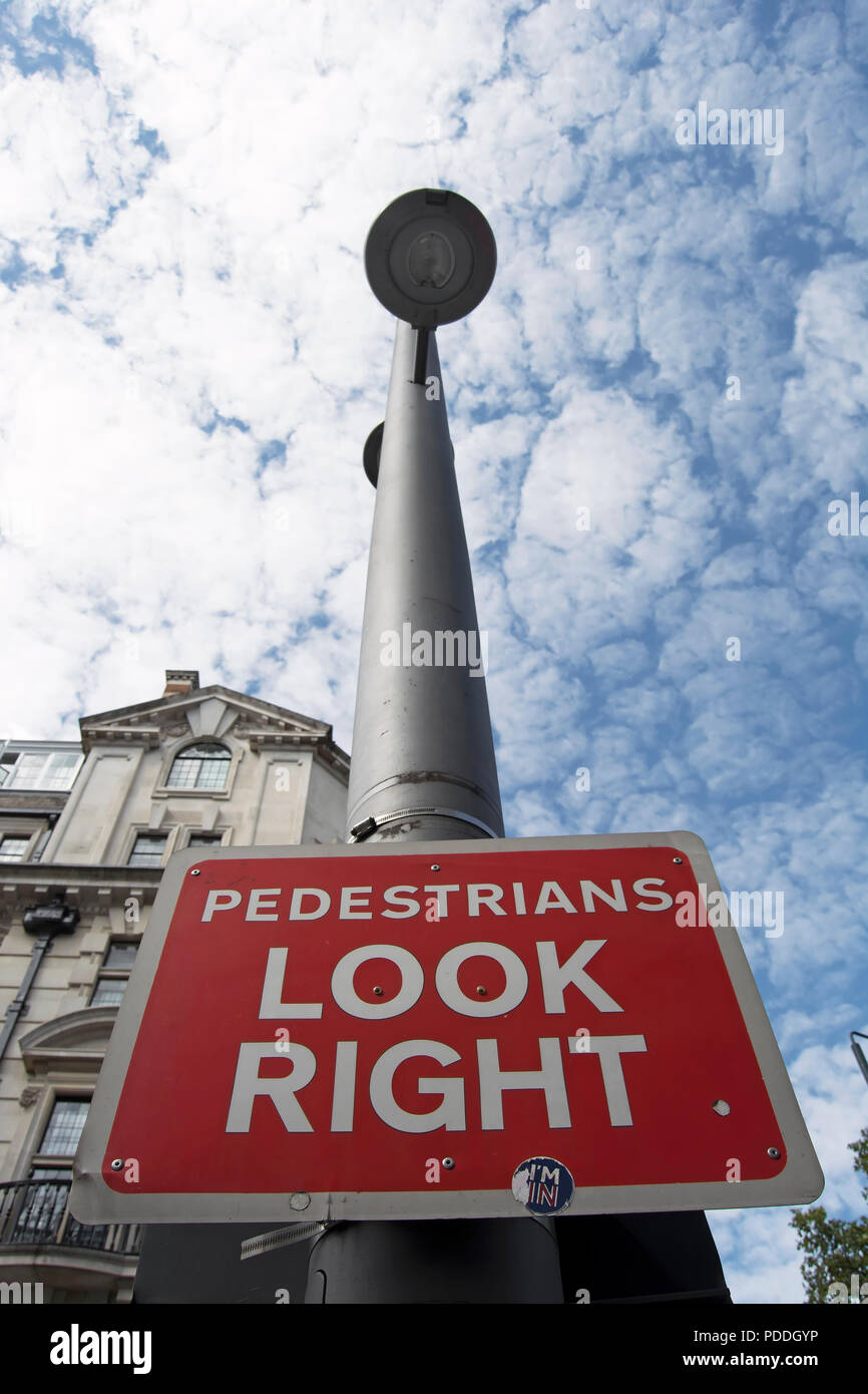 pedestrians look right sign, with partially removed i'm in sticker, in ...