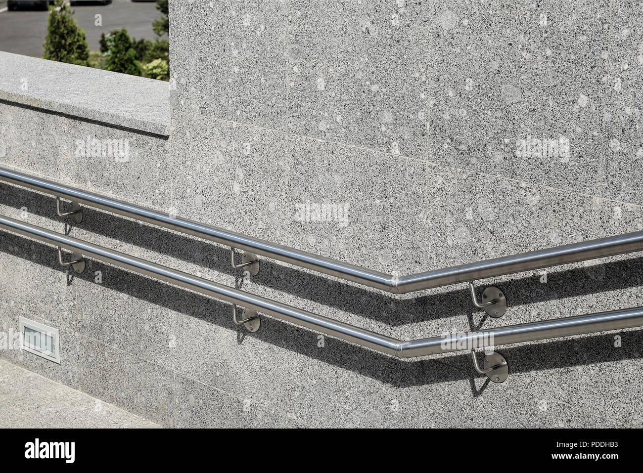 Stairs and steps are decorated with granite and marble tiles with metal ...