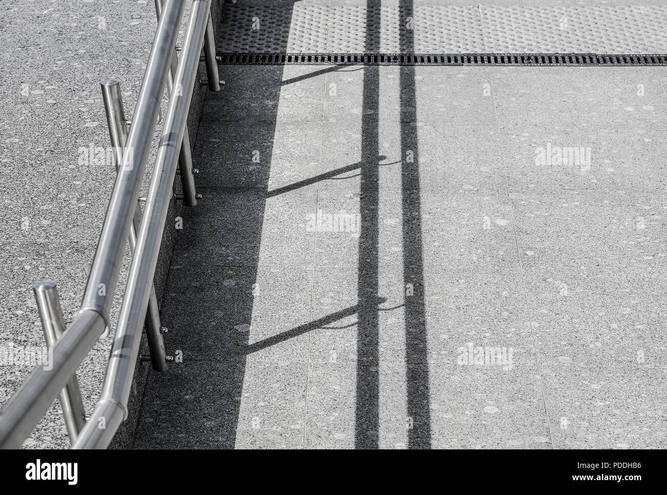 Stairs and steps are decorated with granite and marble tiles with metal ...