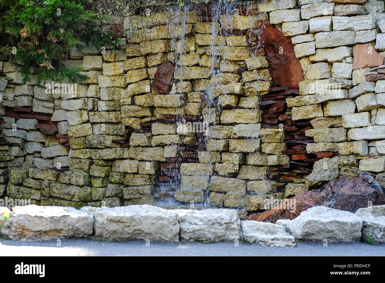 Waterfall in landscape design decorated with natural natural stone ...