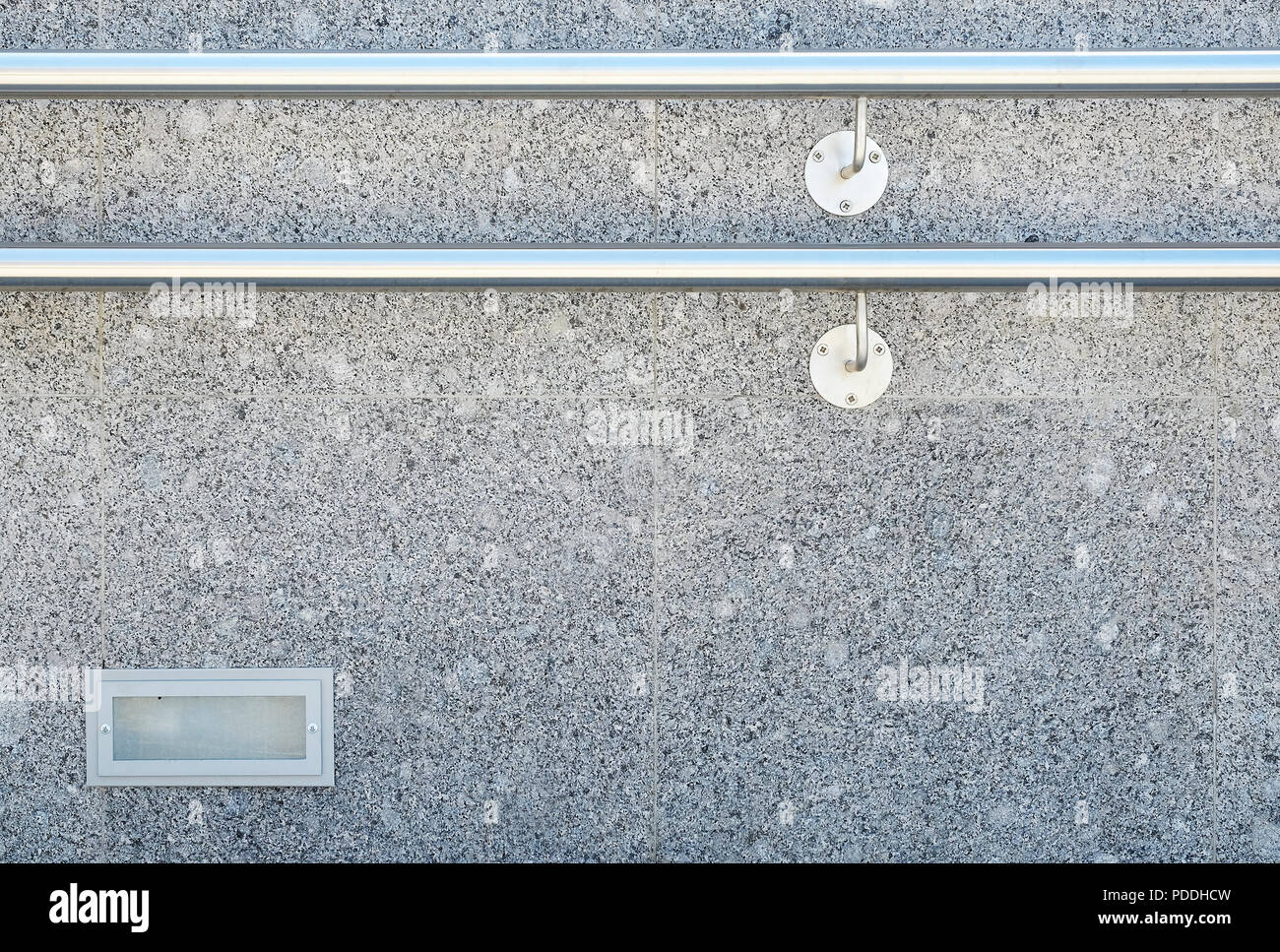 Stairs and steps are decorated with granite and marble tiles with metal ...