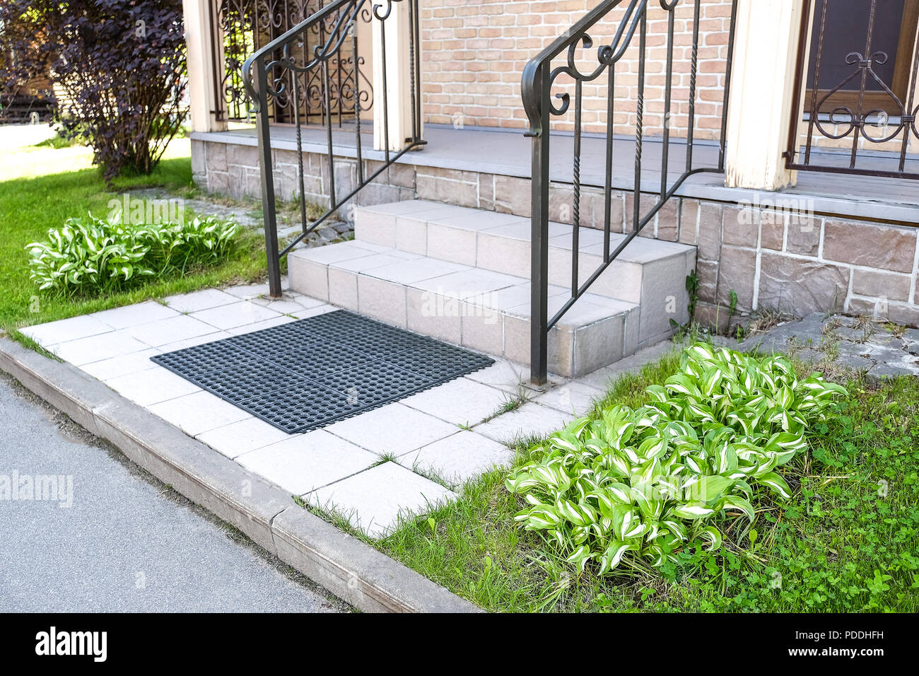 Country house with stone steps. And forged metal railing Stock Photo ...
