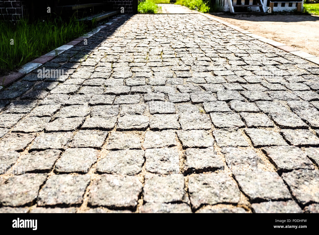 The stone pavement of the blocks. Granite paving Stock Photo - Alamy