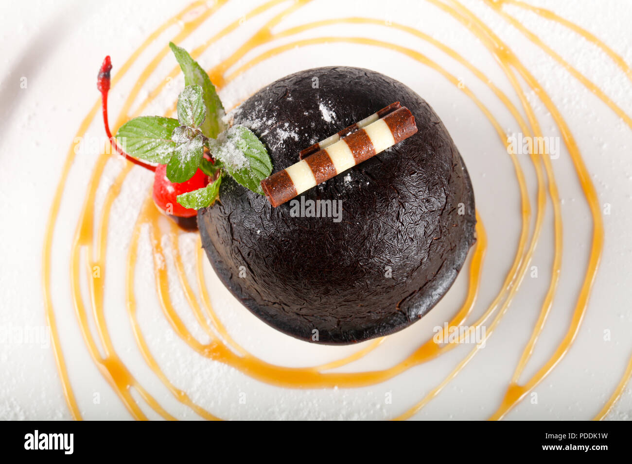 Chocolate cake with cherry and mint Stock Photo - Alamy