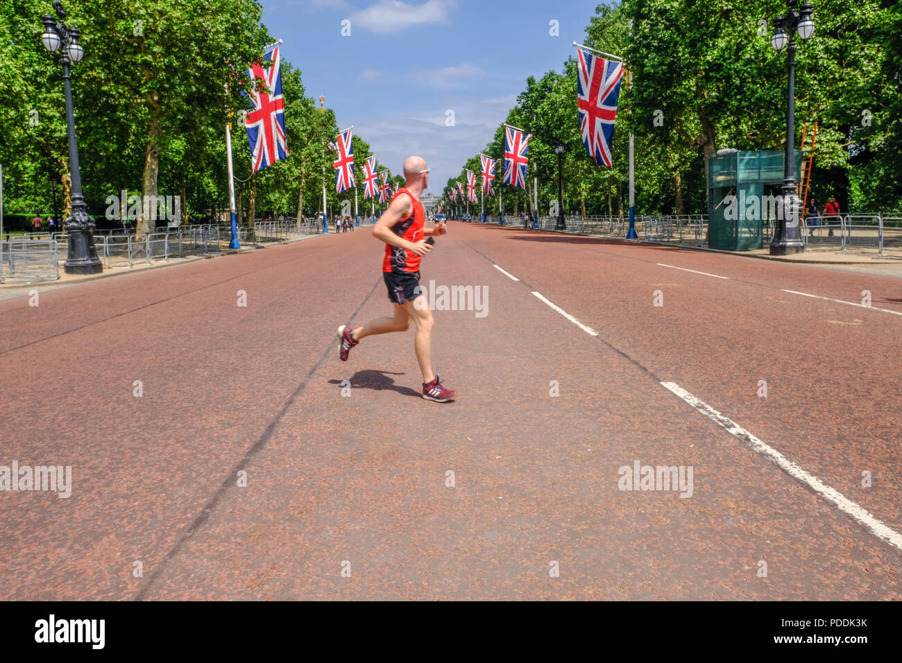 The Mall, London, UK - June 8, 2018: Man jogging across the Mall and ...