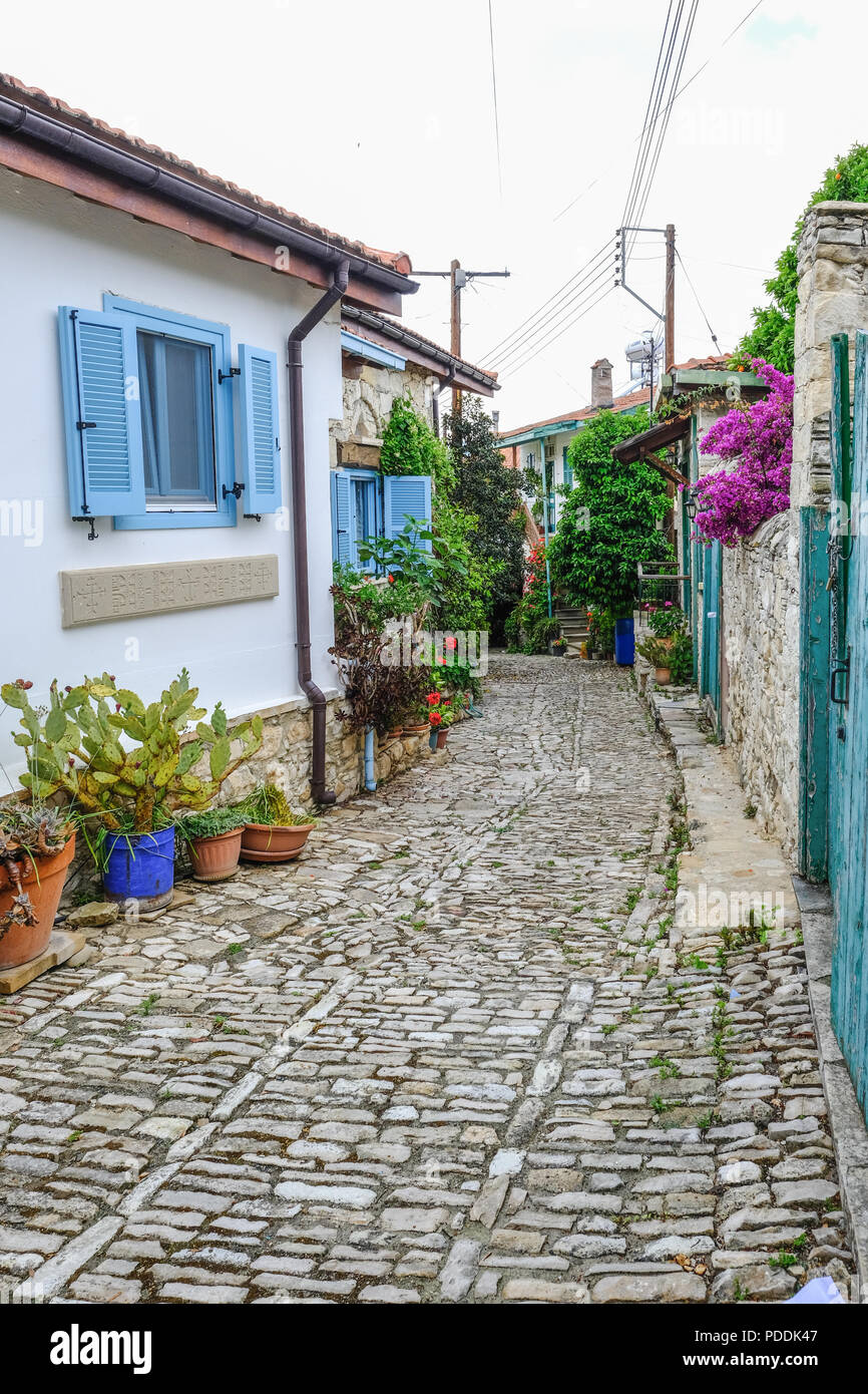Lania, Cyprus - May 13, 2018: Typrical narrow winding cobbled road in ...
