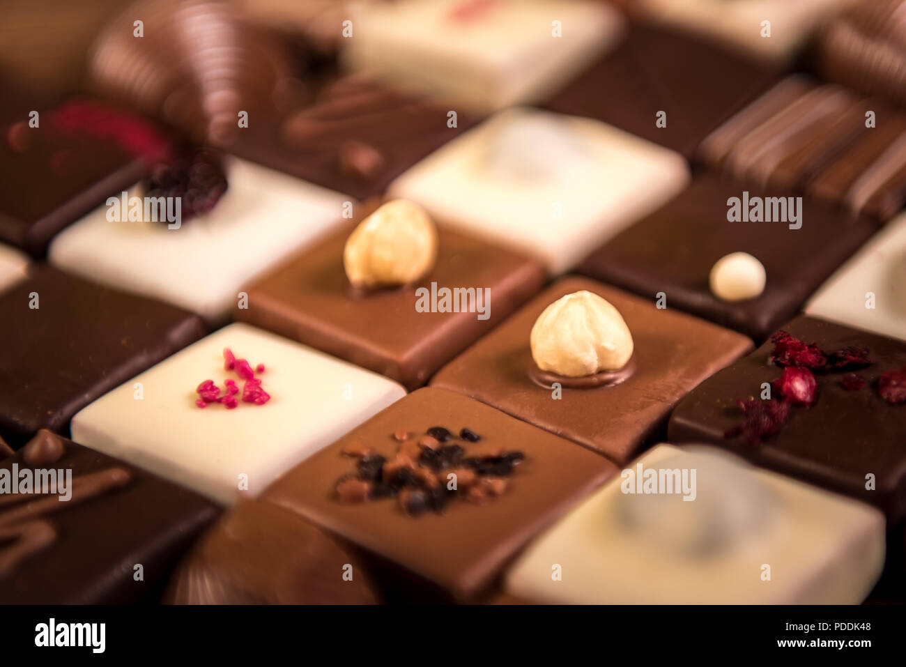 Assortment of fine chocolate candies, white, dark and milk chocolate ...