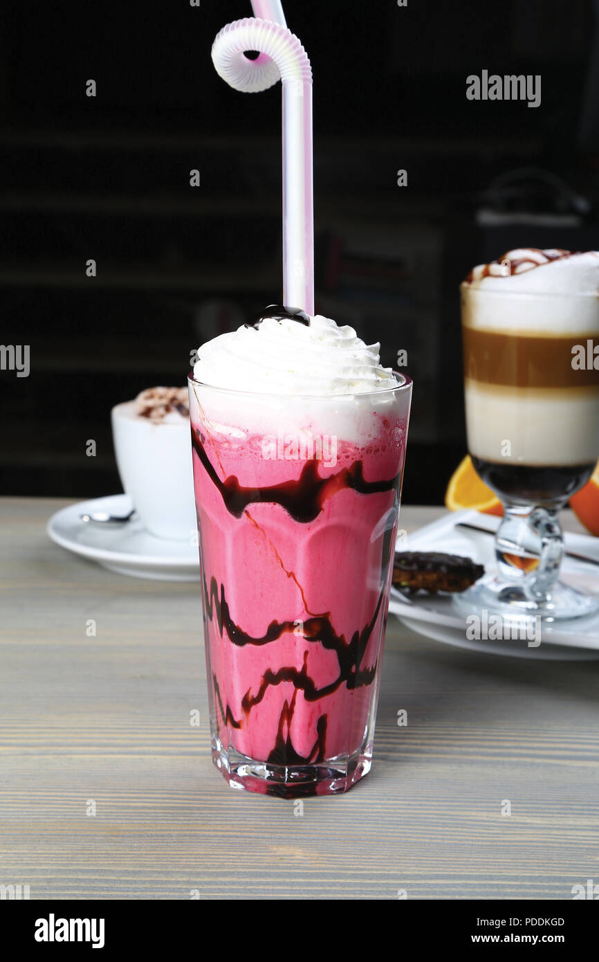 Strawberry Milkshake cocktail with whipped cream Stock Photo - Alamy