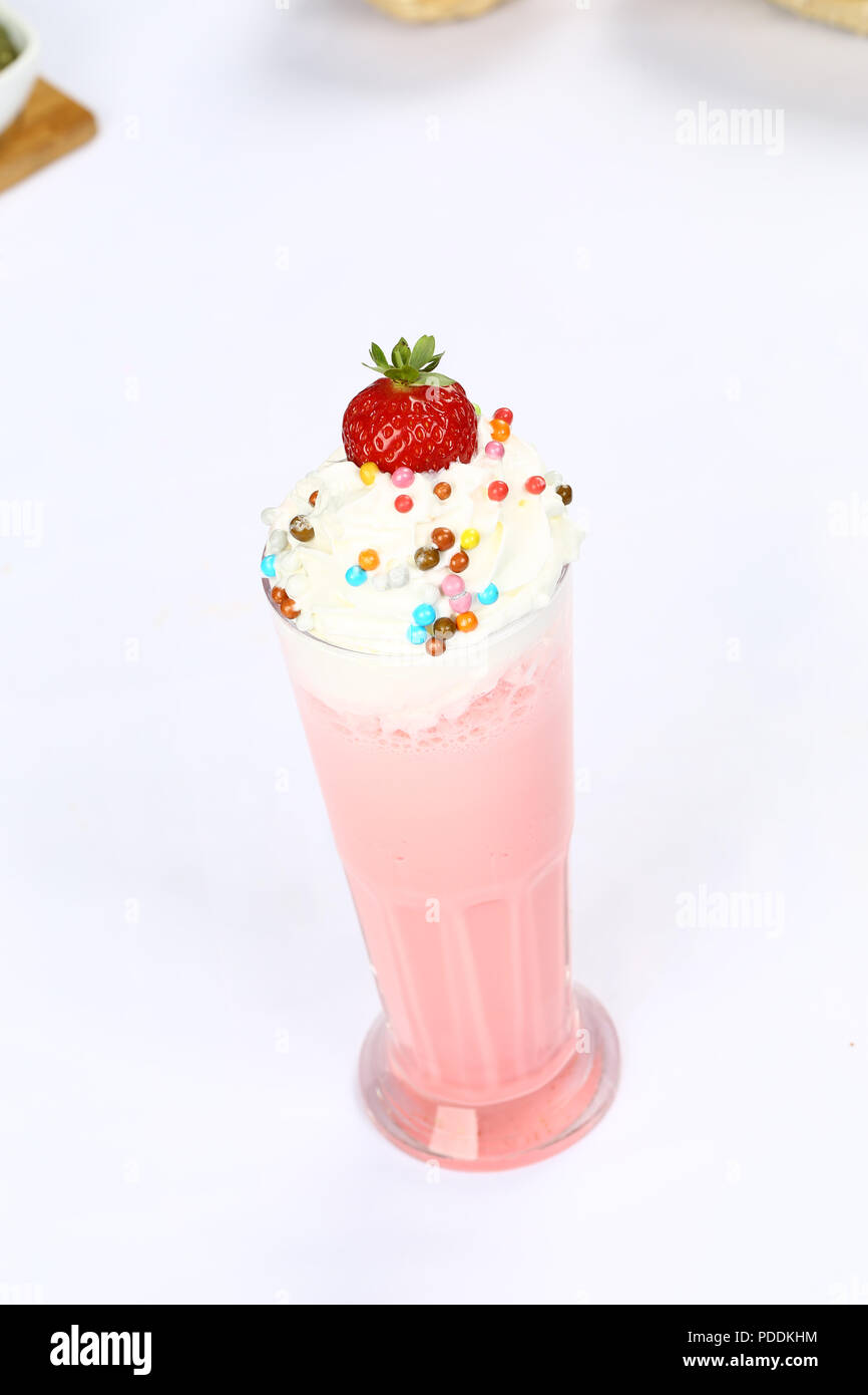 Strawberry Milkshake cocktail with whipped cream Stock Photo - Alamy